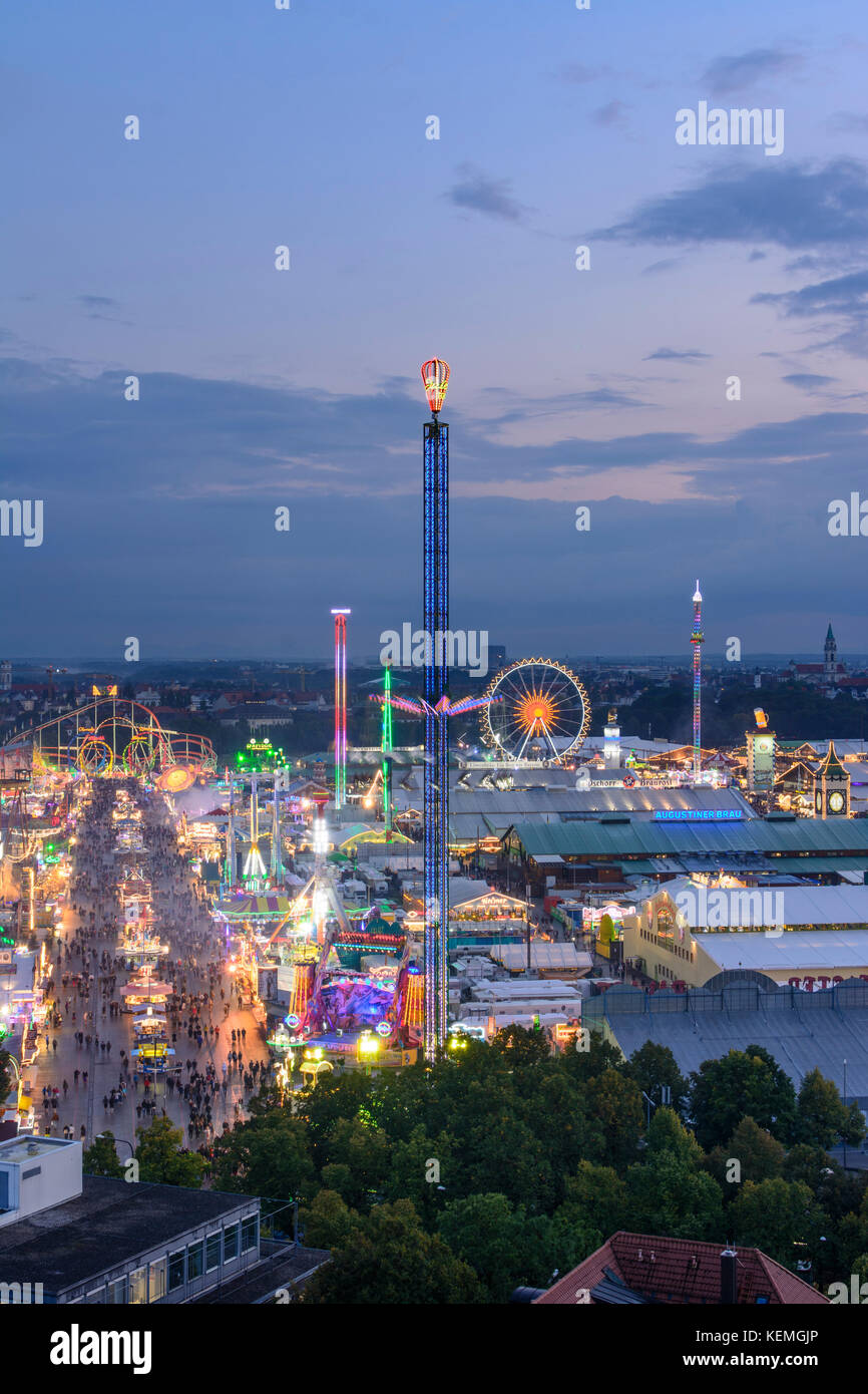 Oktoberfest beer festival: view, beer tent, rides, roller coaster ...