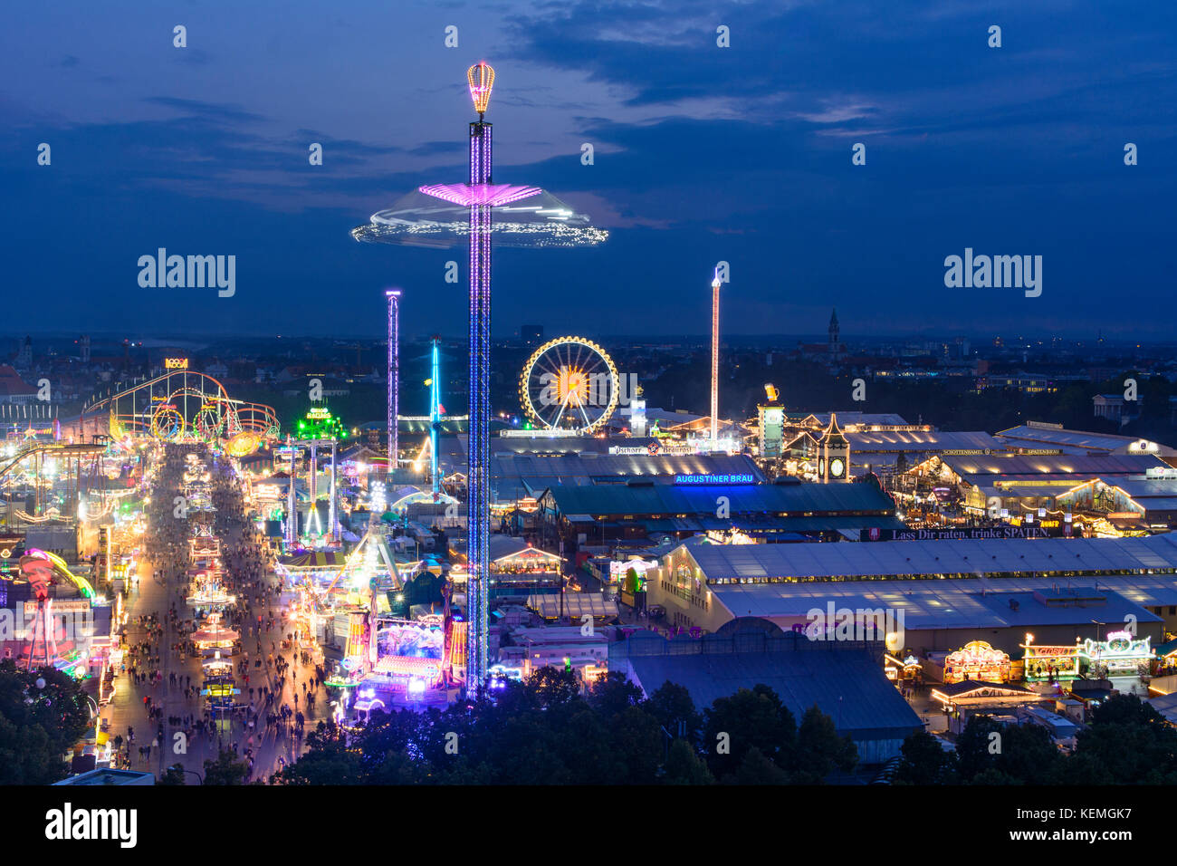 Oktoberfest beer festival: view, beer tent, rides, roller coaster ...