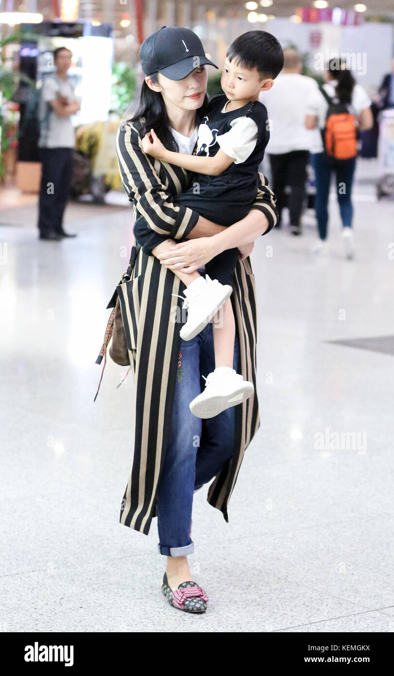 Chinese actress Yao Chen and her son arrive at Beijing Capital ...