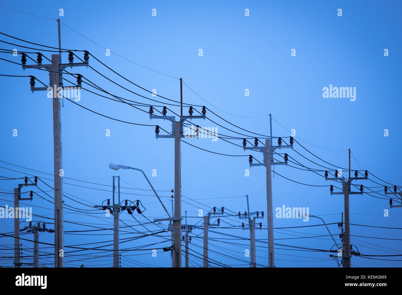 row of electric transmission pylon Stock Photo - Alamy