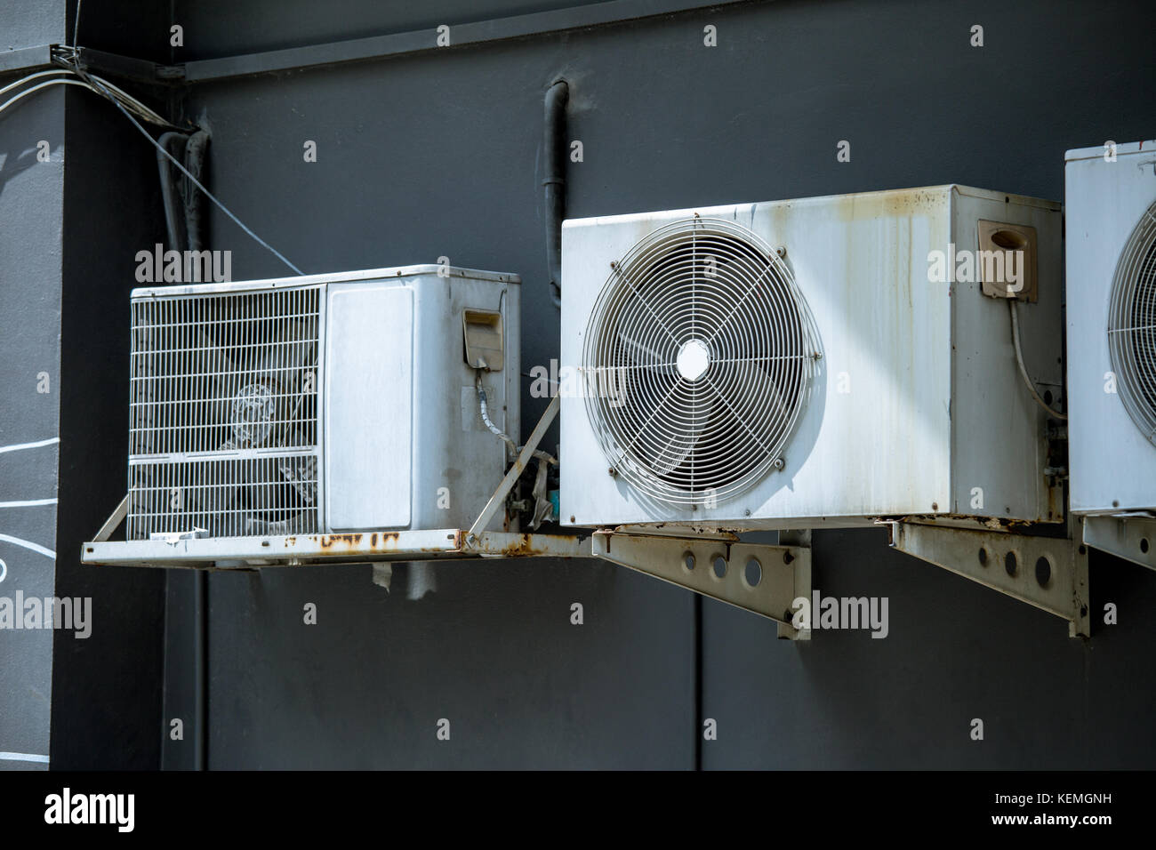 old air compressor unit is hanging on the wall Stock Photo - Alamy