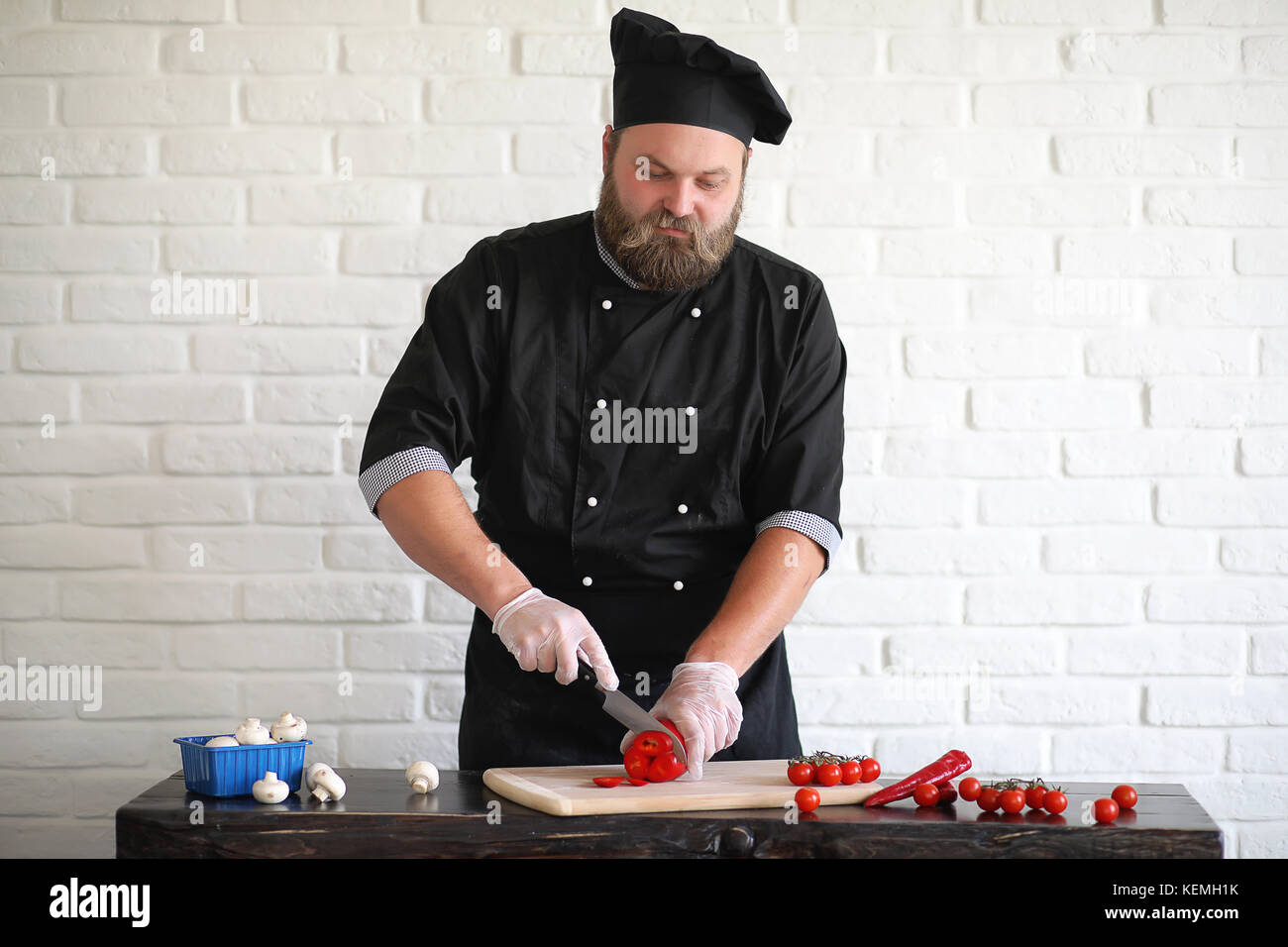 Bearded chef chef prepares meals Stock Photo - Alamy