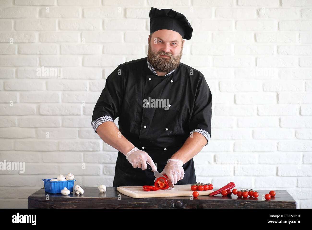 Bearded chef chef prepares meals Stock Photo - Alamy