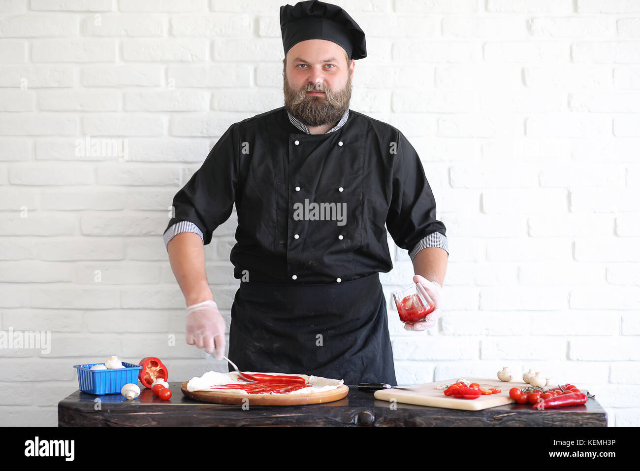 Bearded chef chef prepares meals Stock Photo - Alamy