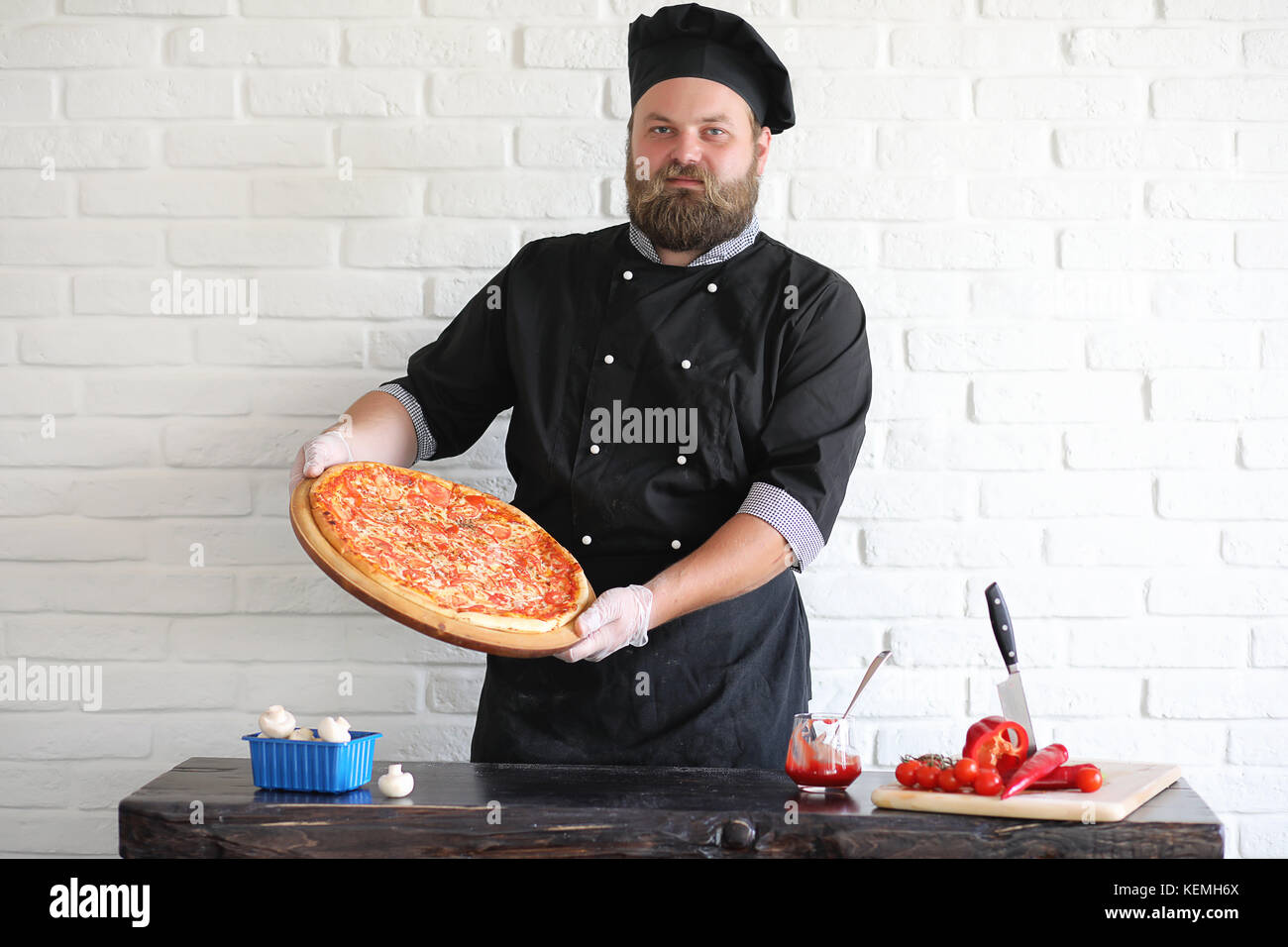 Bearded chef chef prepares meals Stock Photo - Alamy