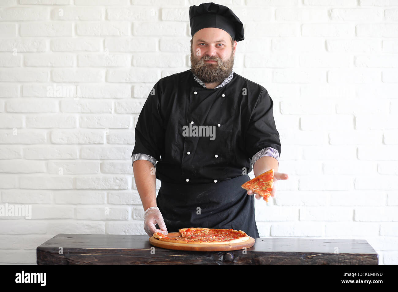 Bearded chef chef prepares meals Stock Photo - Alamy