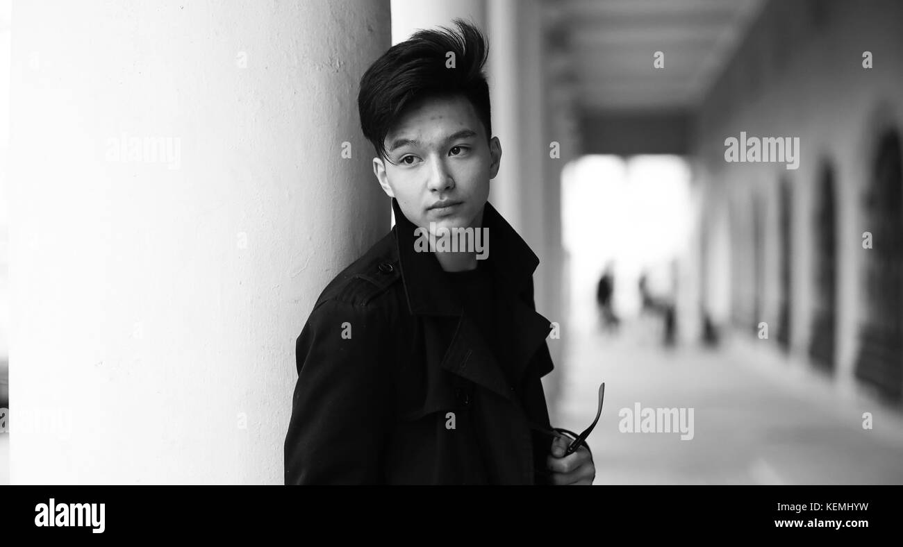 Black White photo of Asian young man outdoors posing Stock Photo - Alamy
