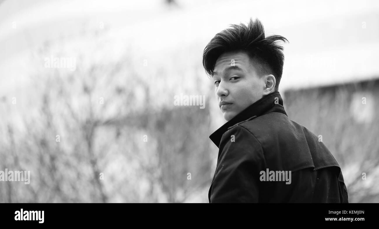 Black White photo of Asian young man outdoors posing Stock Photo - Alamy