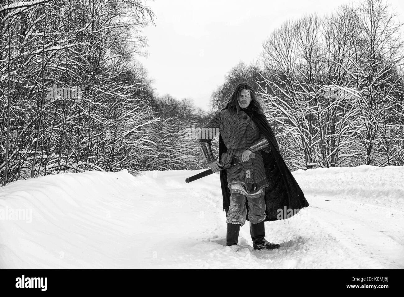 Defender the young warrior in armor Stock Photo - Alamy