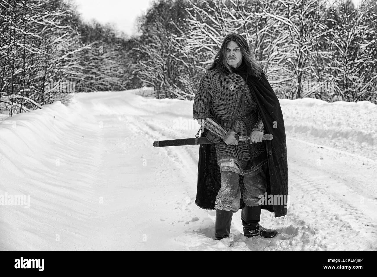 Defender the young warrior in armor Stock Photo - Alamy