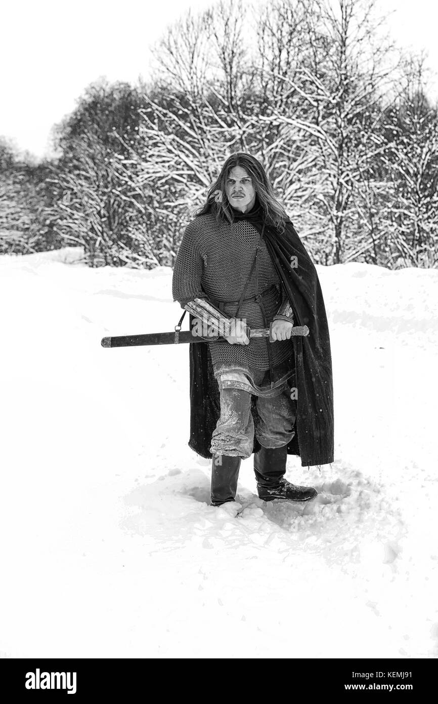 Defender the young warrior in armor Stock Photo - Alamy