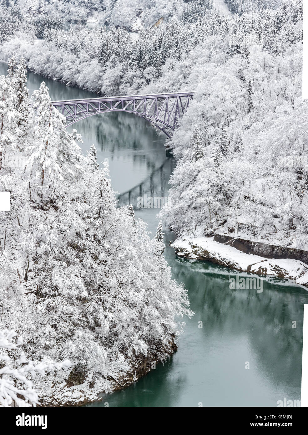 Winter landscape snow covered trees with train crossin River on Bridge ...