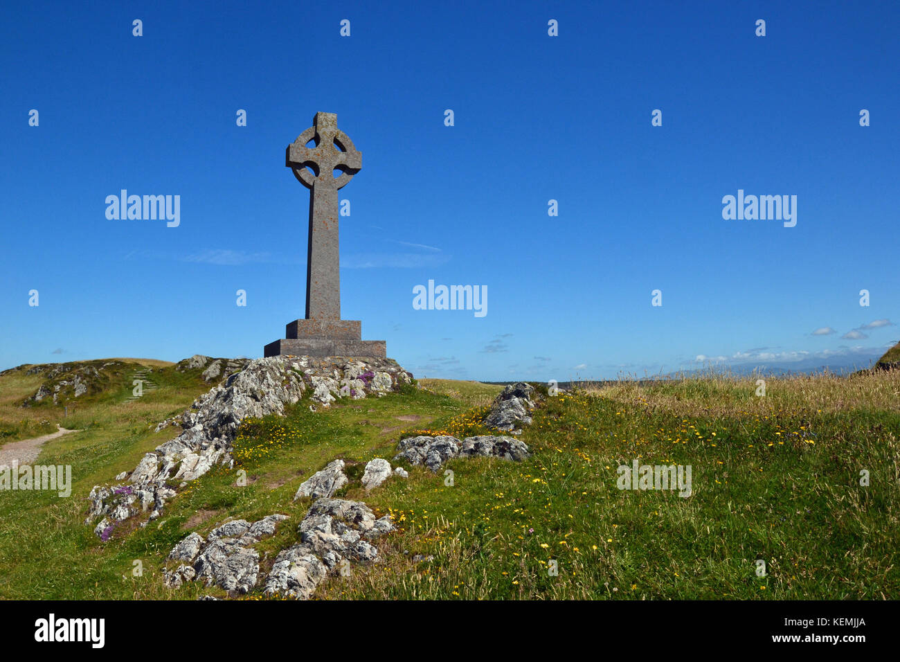 Celtic cross monument on Llanddwyn Island, Anglesey, Wales Stock Photo ...