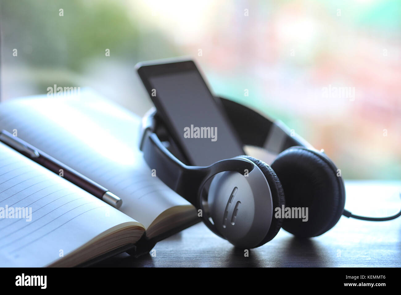 Stack of books with headphone hi-res stock photography and images - Alamy
