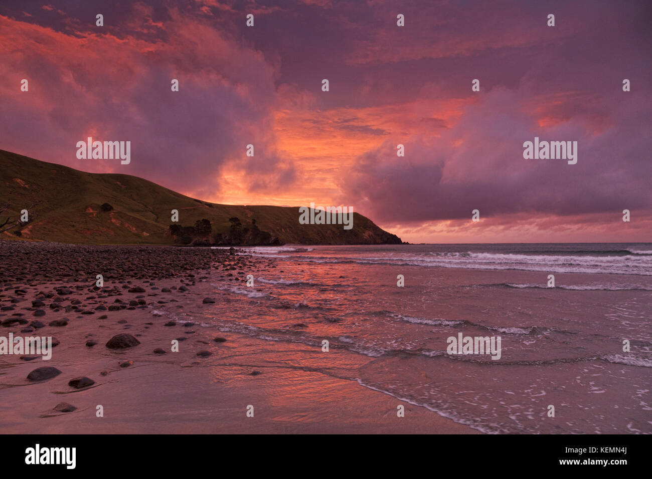 The bay at Port Jackson, Coromandel, New Zealand, at sunset Stock Photo ...