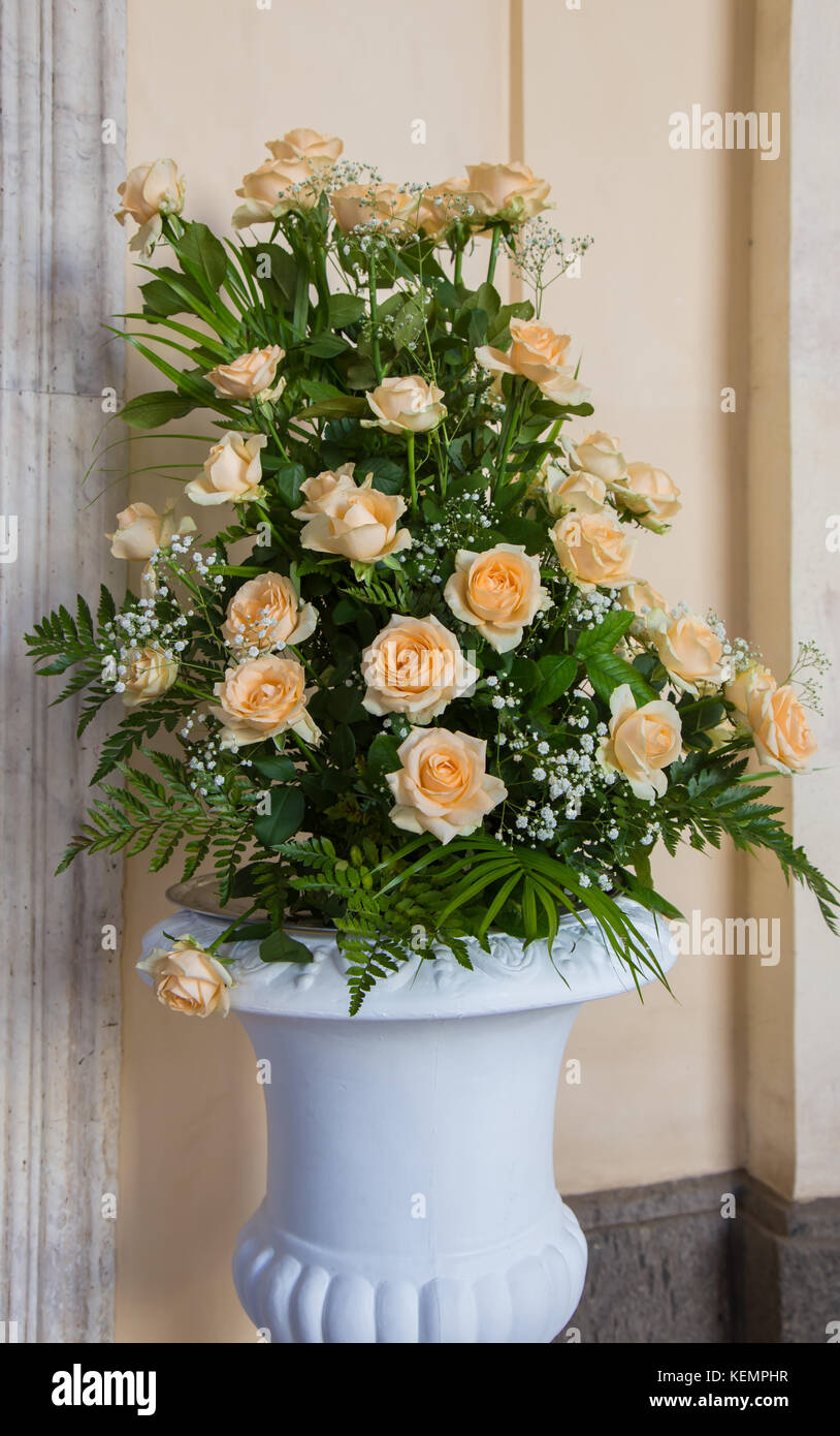 Composition of yellow roses in a white vase Stock Photo - Alamy
