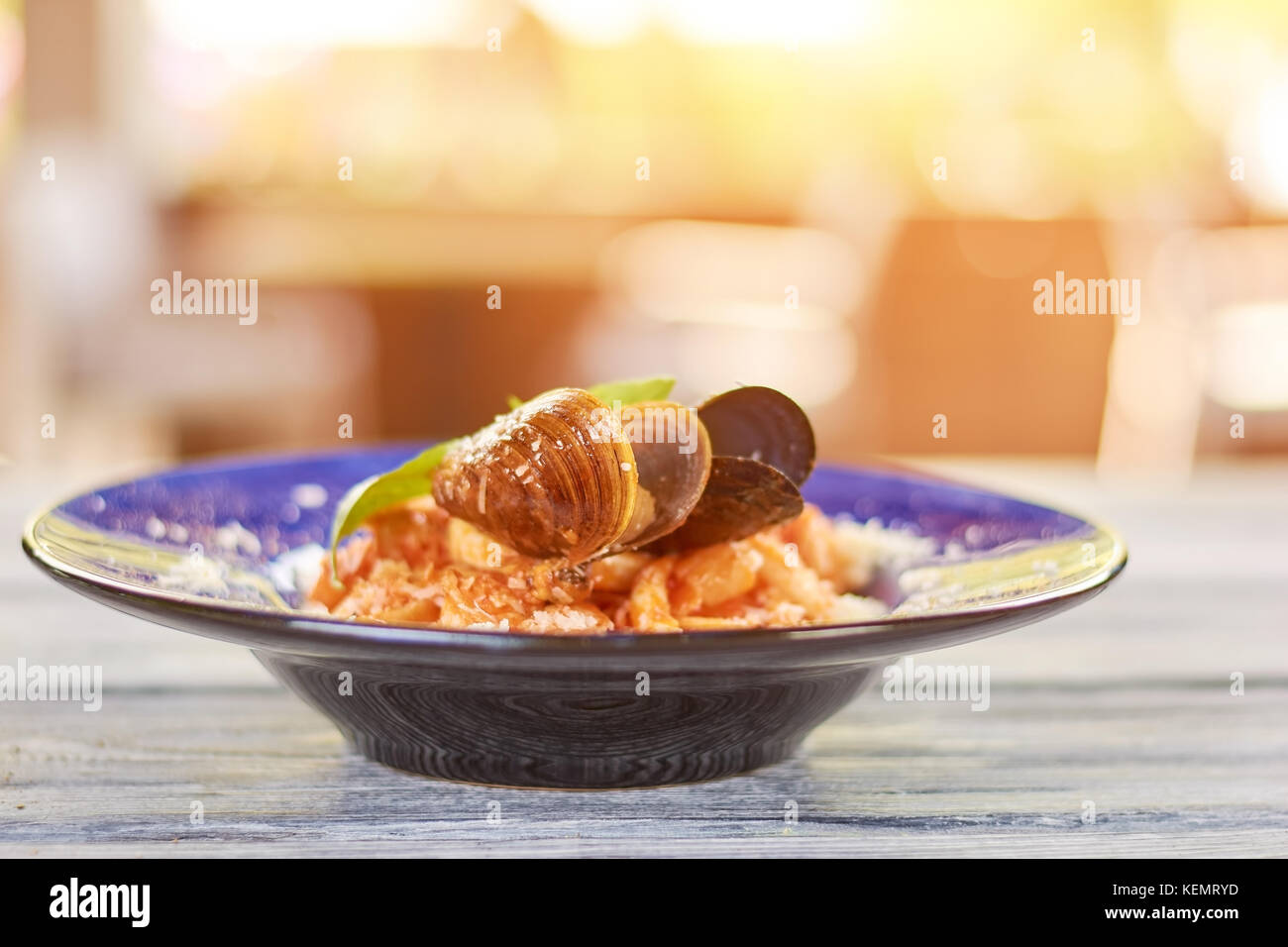 Delicious pasta with mussels on blurred background. Pasta frutti di ...