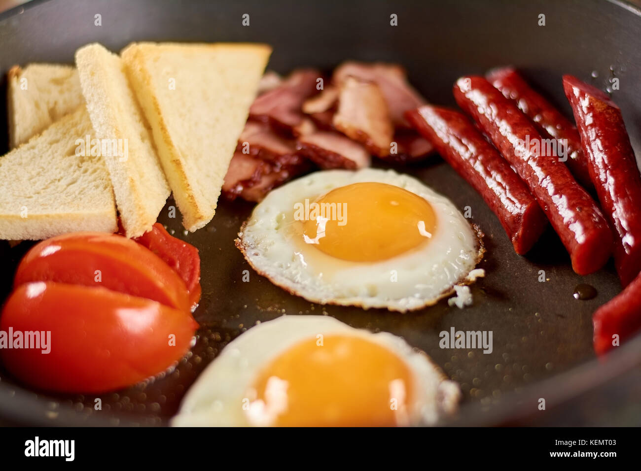 Full english breakfast in pan. English breakfast in pan with fried eggs ...