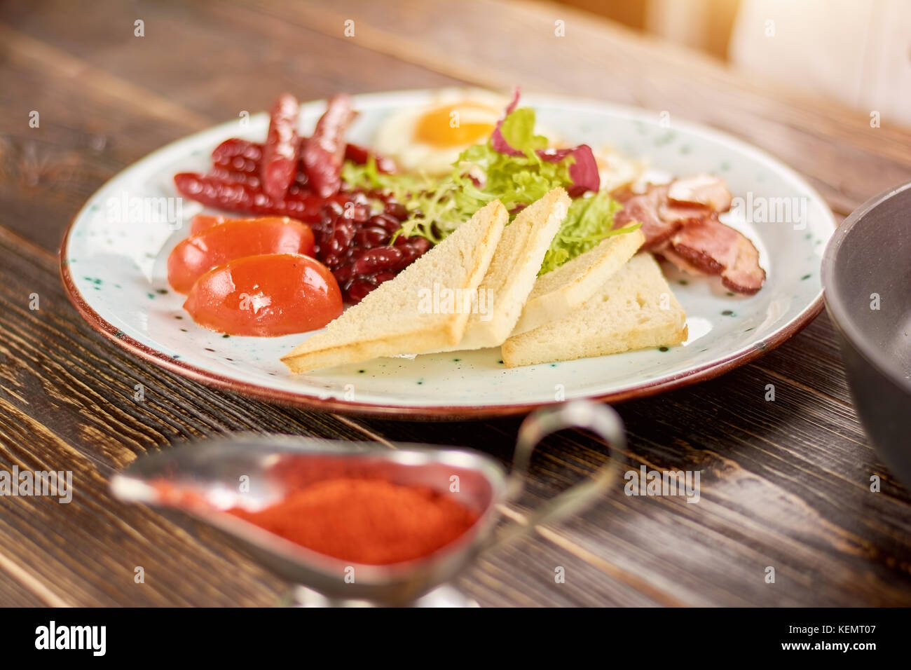English breakfast on plate. English breakfast with toasts, tomatoes ...