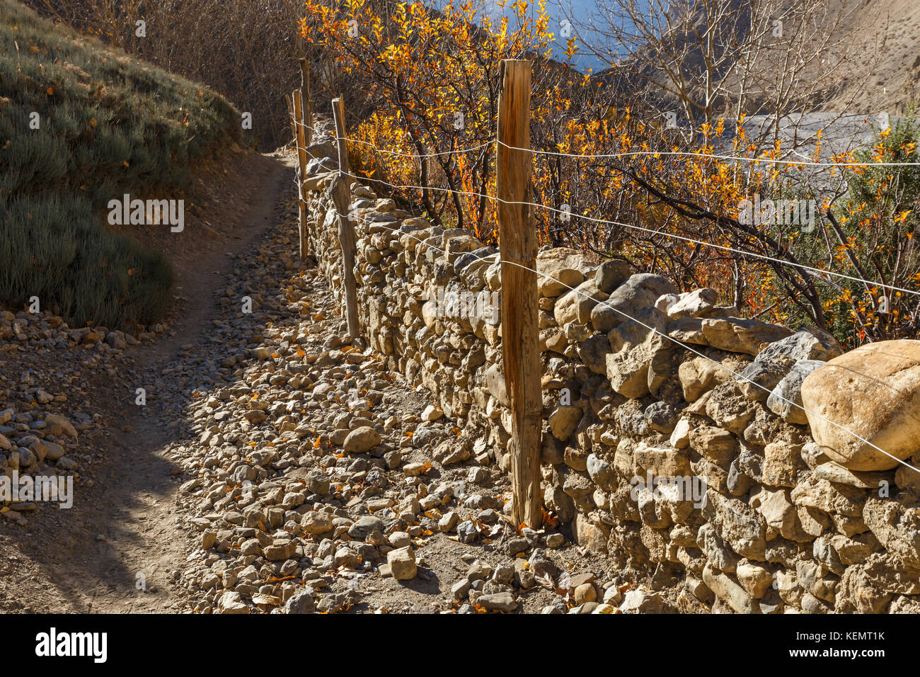 mountain trail, fence mesh and stone Stock Photo - Alamy