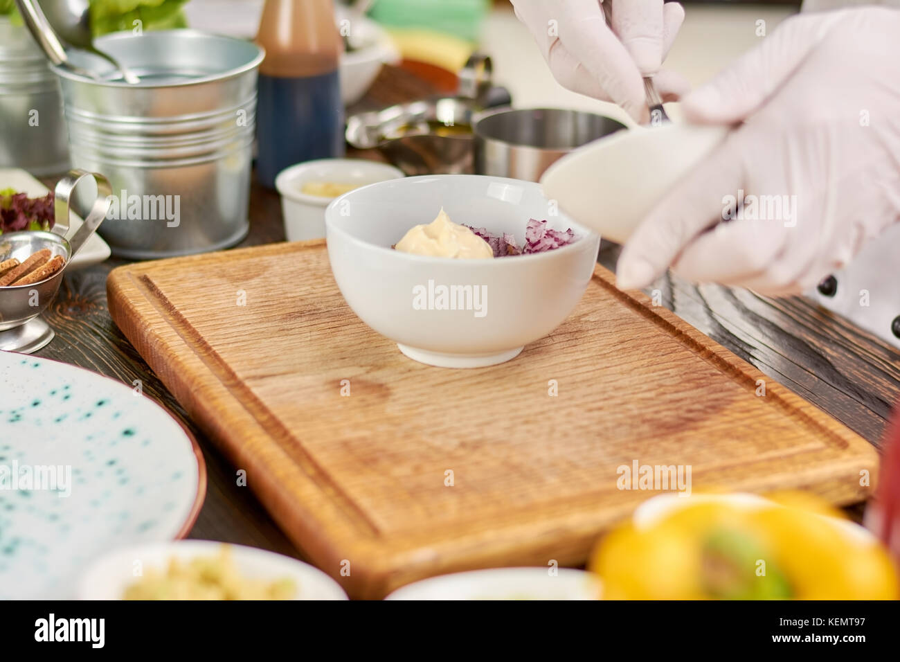 Chef cooking appetizer at kitchen. Cropped image of chef at kitchen ...