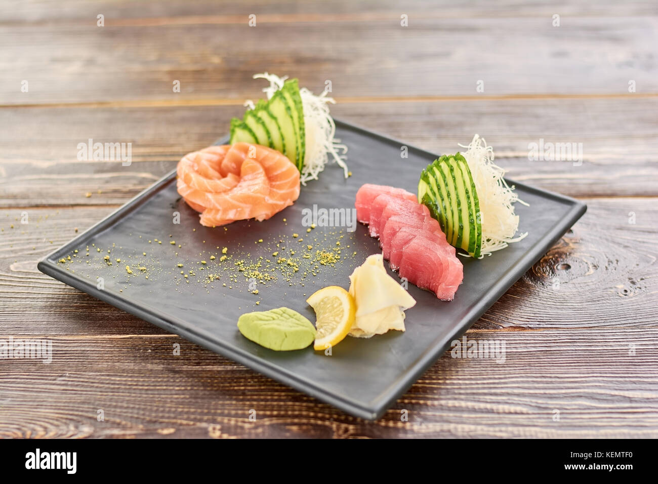 Salmon and tuna sashimi on wooden table. Delicious food of japanese ...