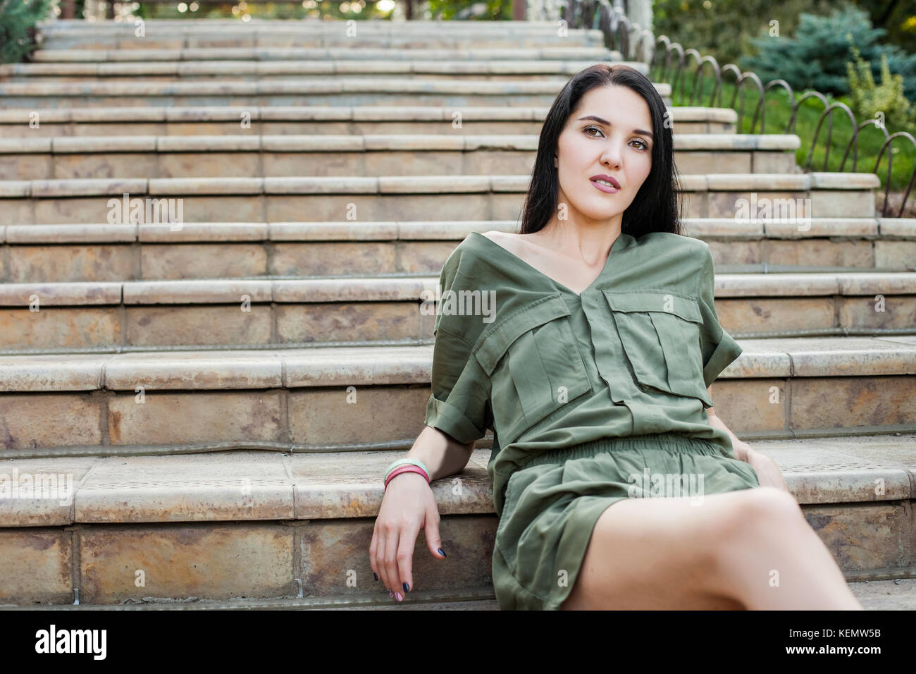 woman sitting on stone steps Stock Photo - Alamy