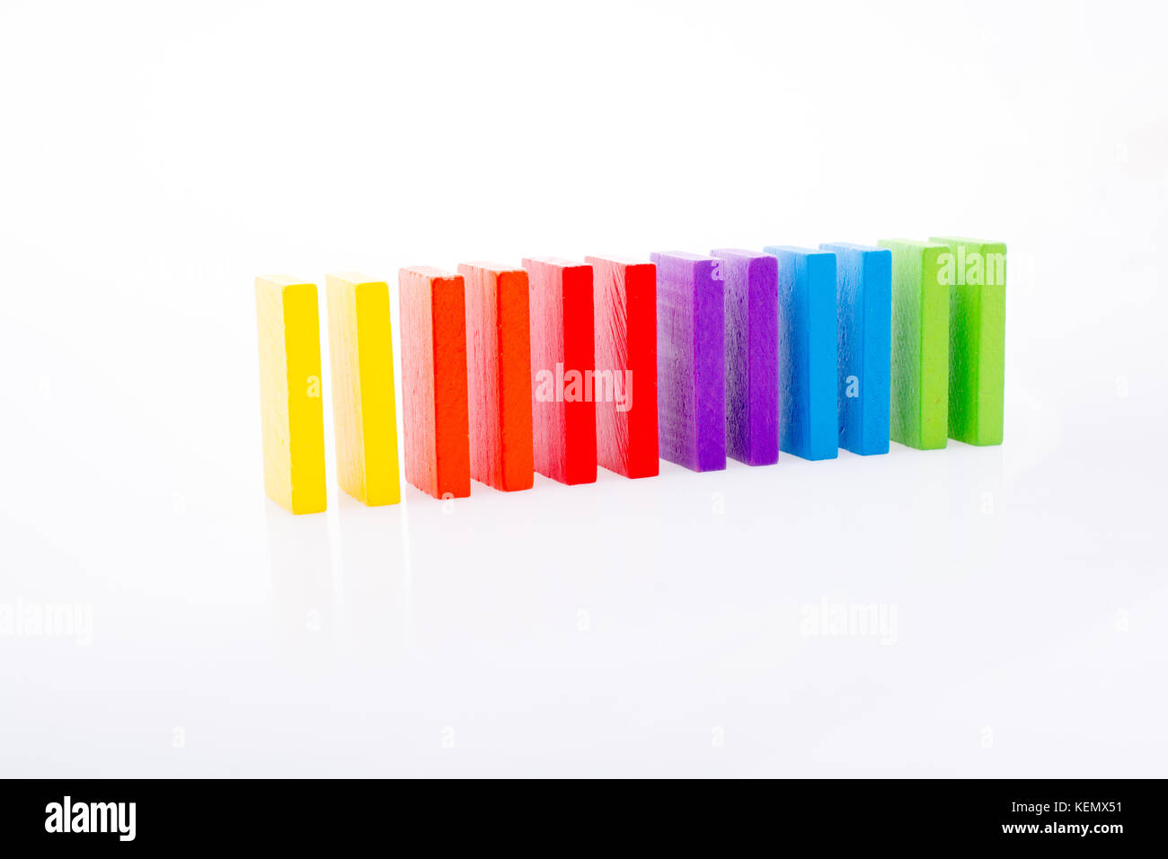 Colorful Domino Blocks in a line on a white background Stock Photo - Alamy