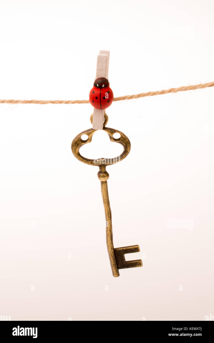 Retro styled golden color key attached to a string in view Stock Photo ...