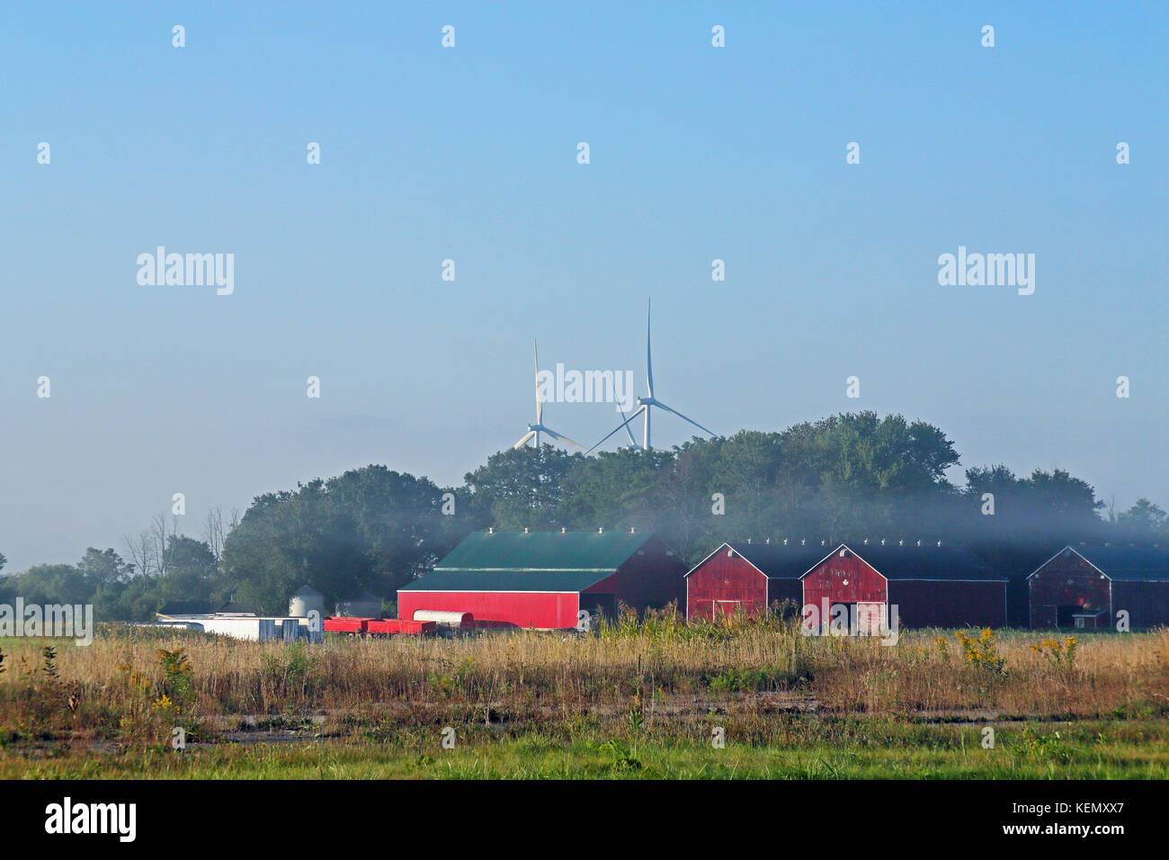Rural landscape with barns trees and wind turbines in Southern Ontario ...