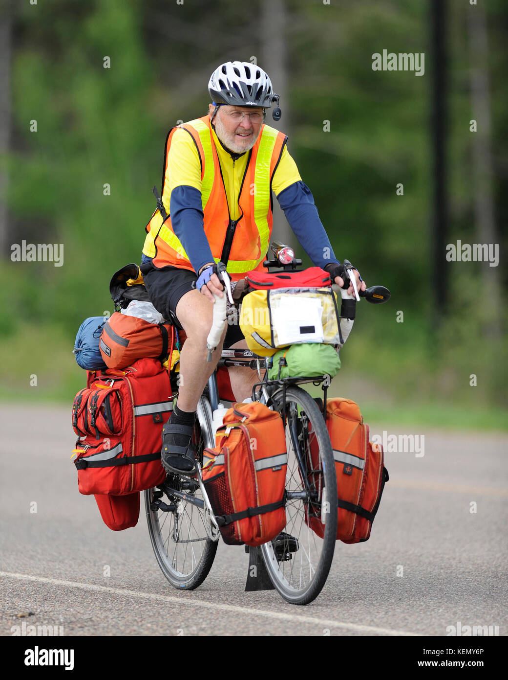 A bicyclist crests a long hill Stock Photo - Alamy