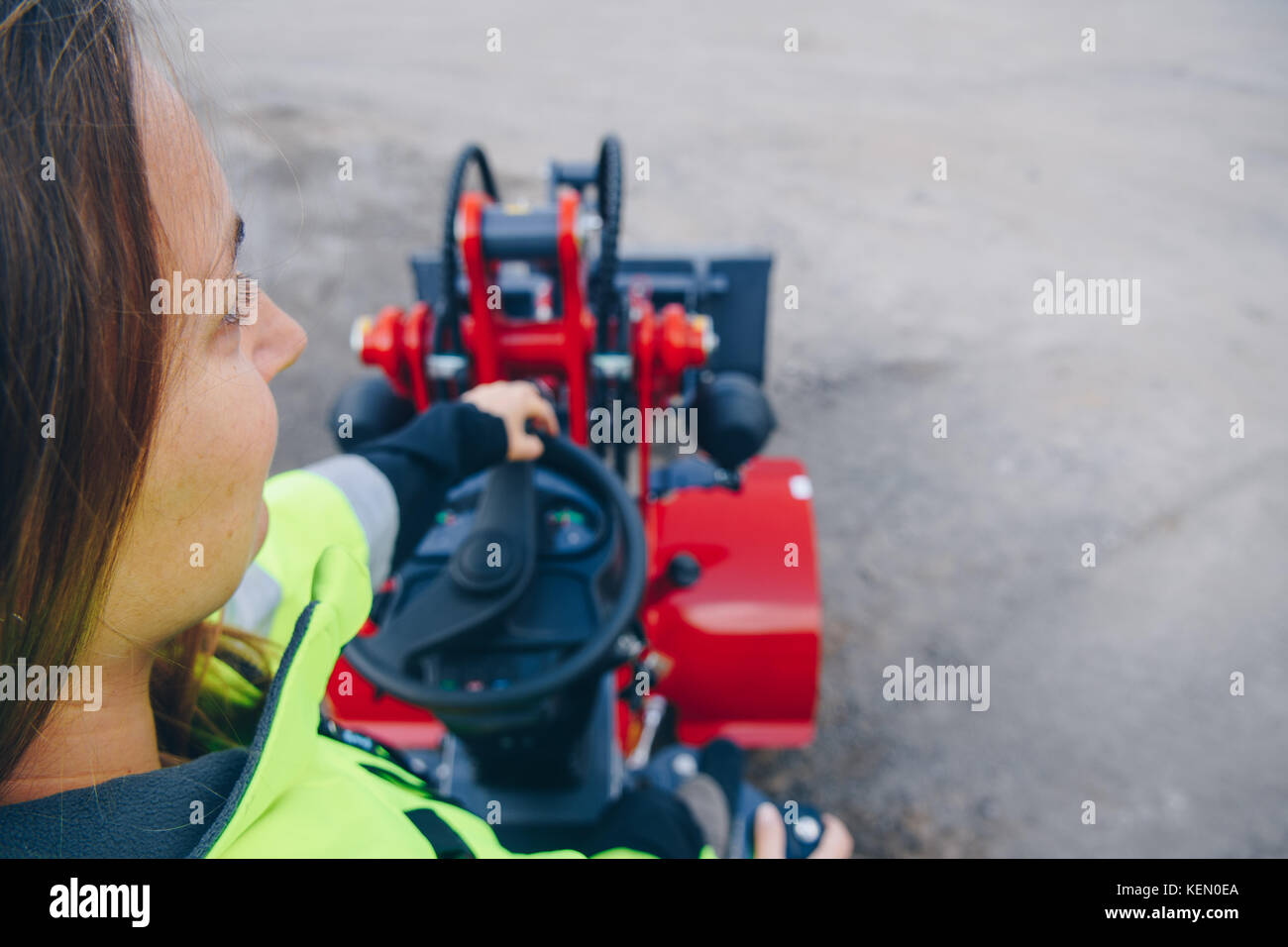 Woman operating heavy equipment Stock Photo - Alamy