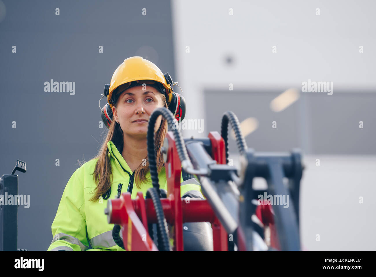 Woman operating heavy equipment Stock Photo - Alamy