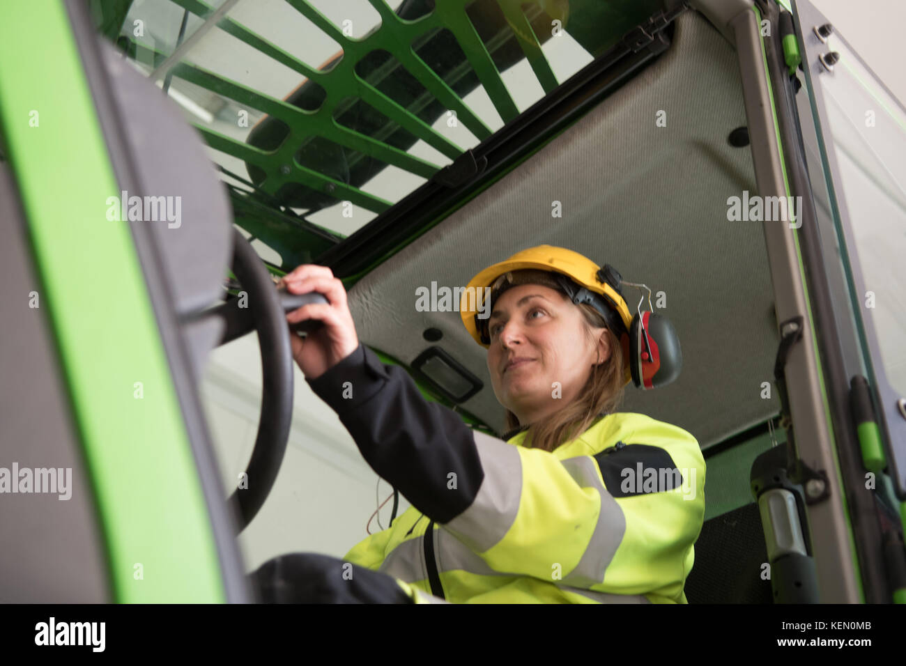 Woman operating heavy equipment Stock Photo - Alamy