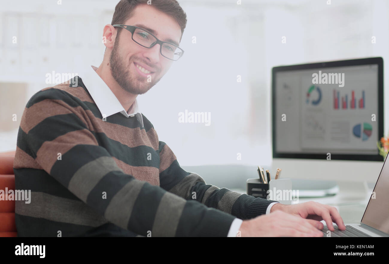 Handsome young business man working in meeting room Stock Photo - Alamy