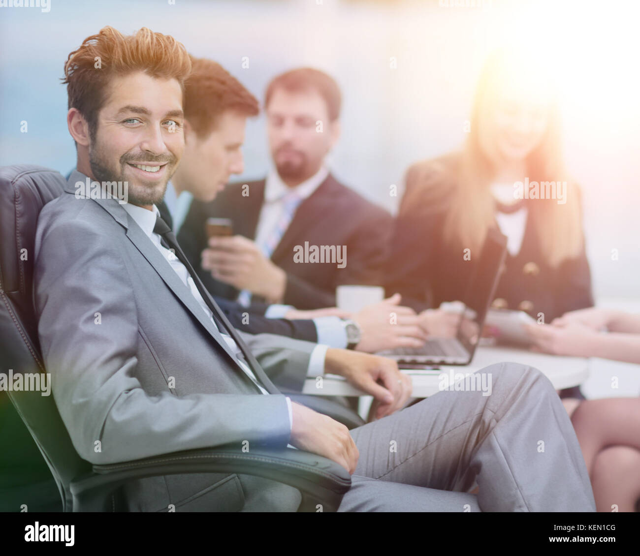 Face of handsome businessman on the background of business people Stock ...