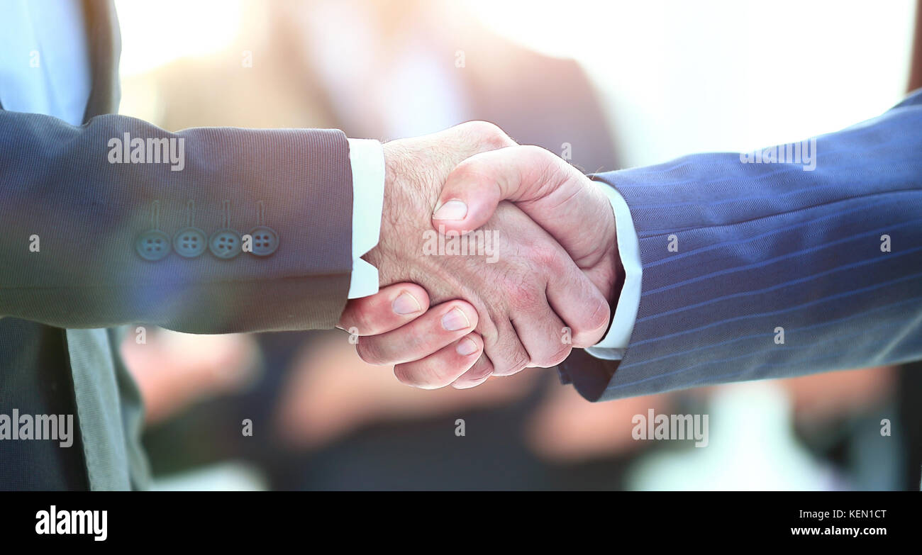 Business handshake. Business man giving a handshake to close the deal ...