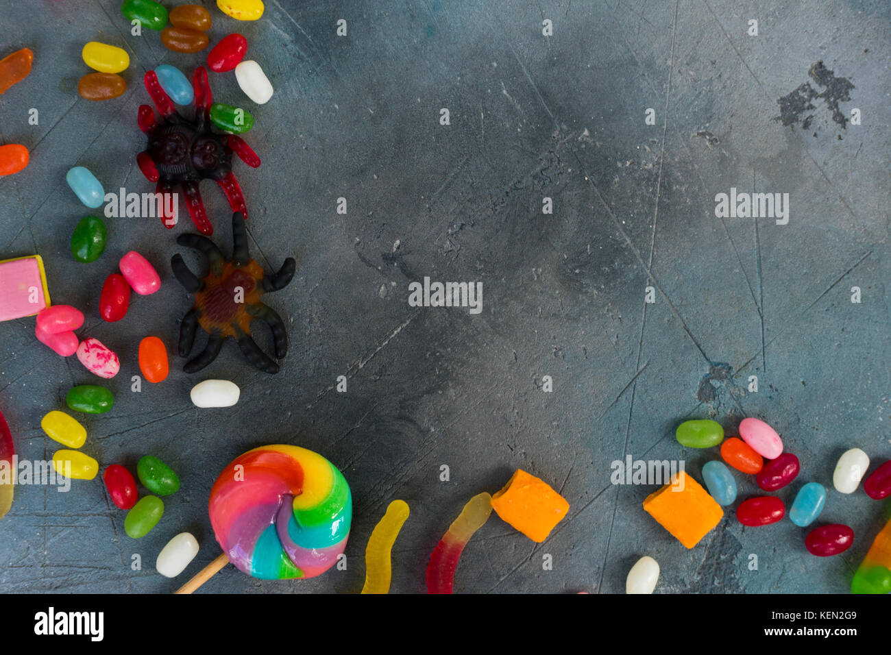 Trick and treat - halloween scary candies on gray stone with copy space ...