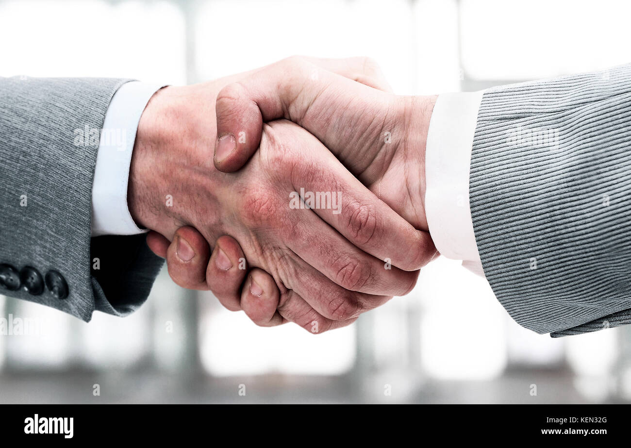 handshake of business partners after discussion of the financial Stock ...