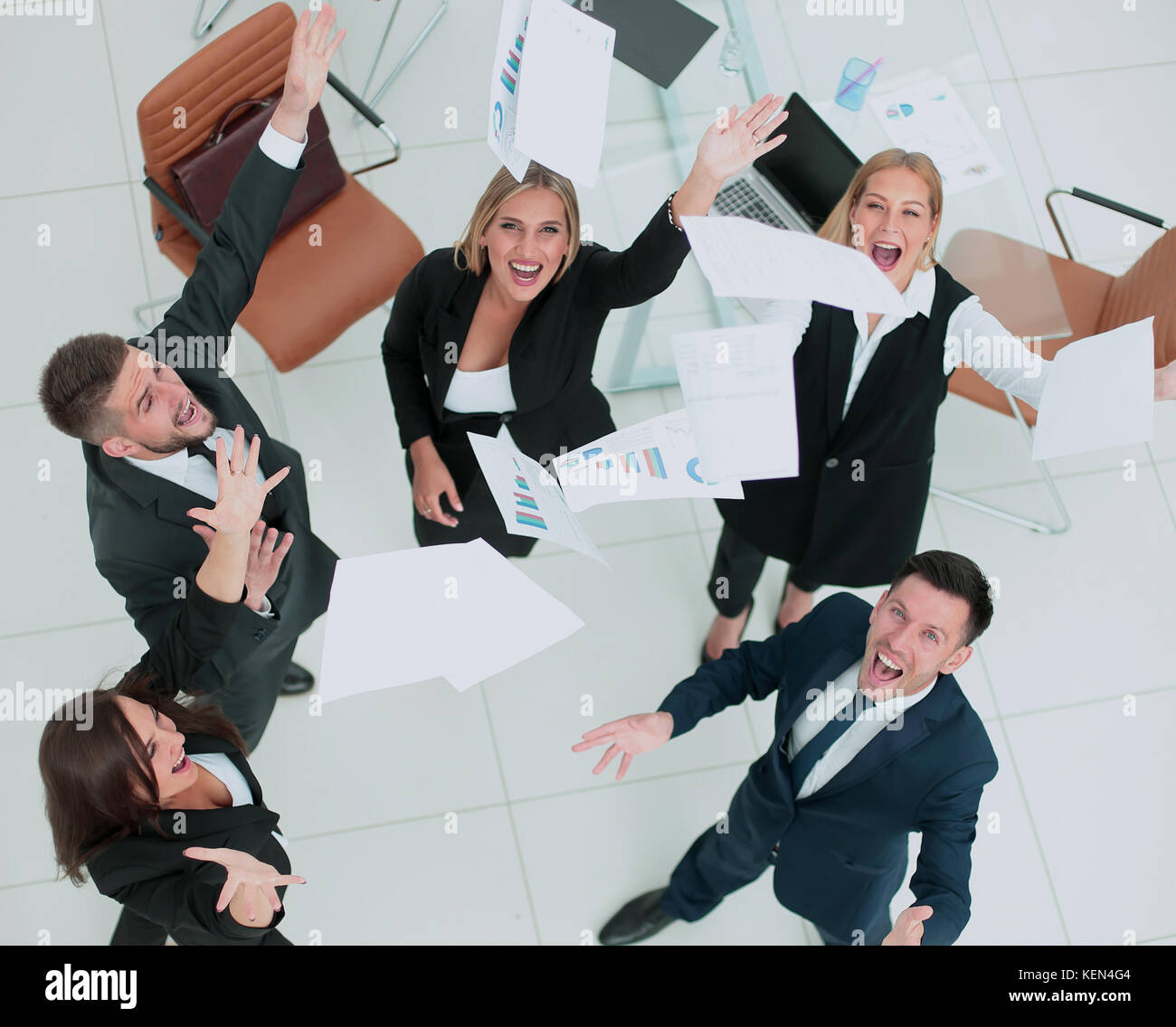 Happy business people throw into the air the documents Stock Photo - Alamy