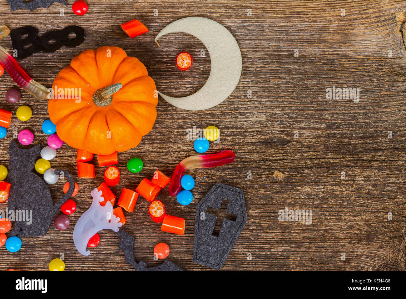 Trick and treat - colorful halloween scene on aged wood with copy space ...