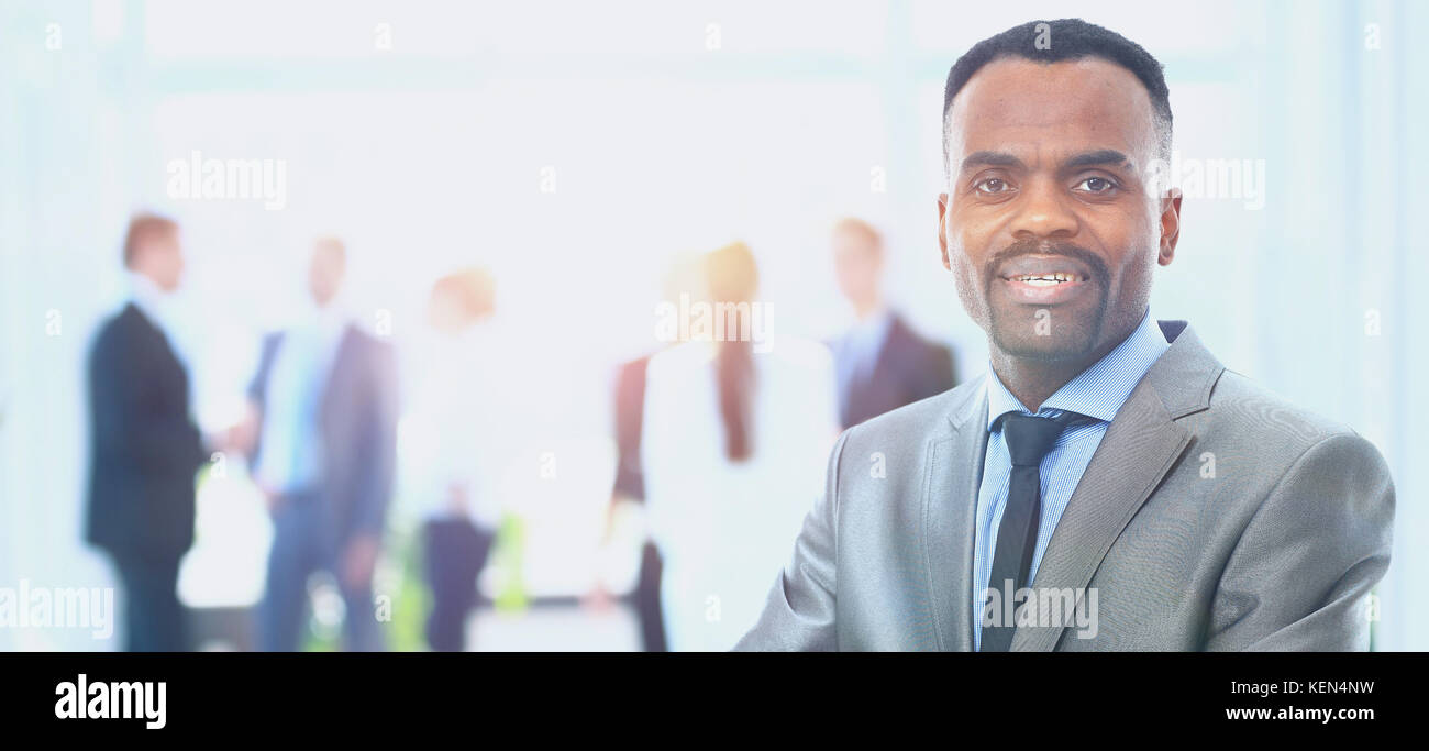 Portrait of a successful american african businessman smiling leading ...