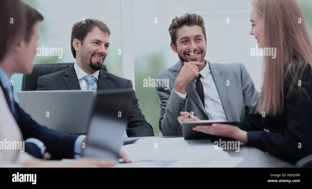 manager discussing work with his colleagues Stock Photo - Alamy