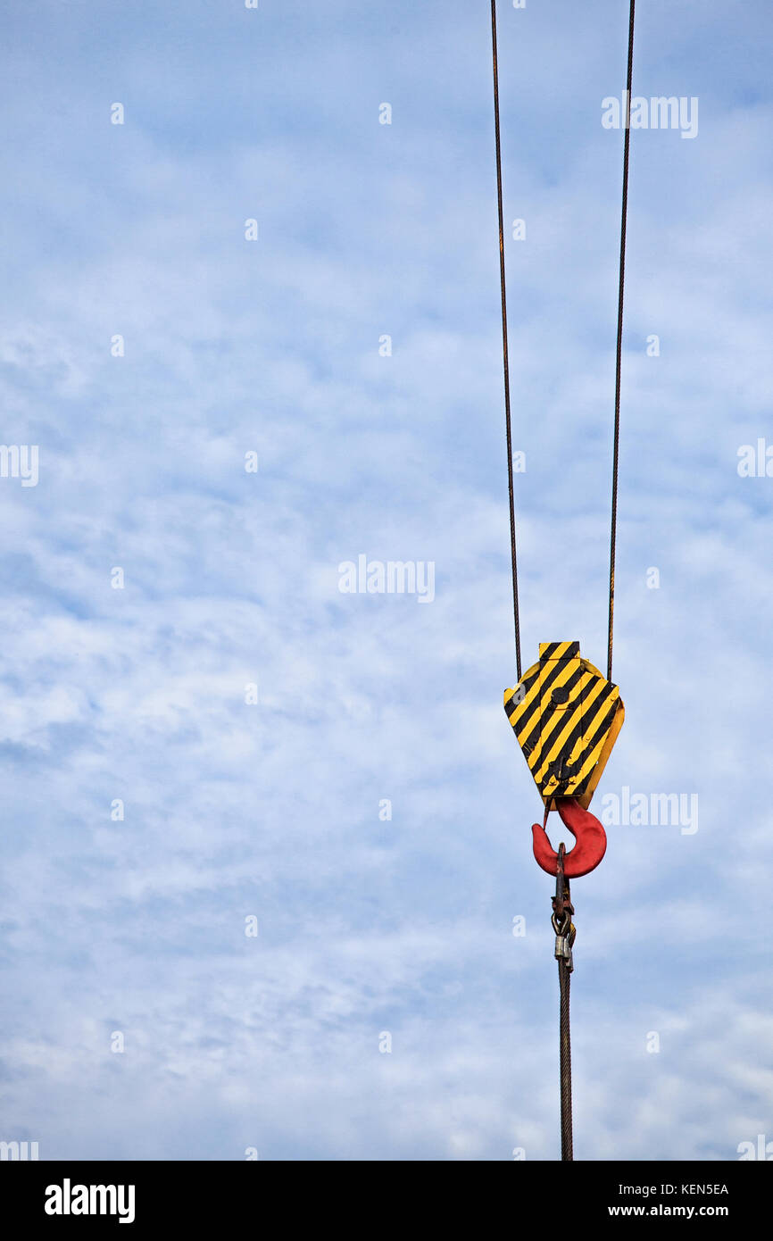 Yellow lifting hook on the cable, with a free place for the inscription ...