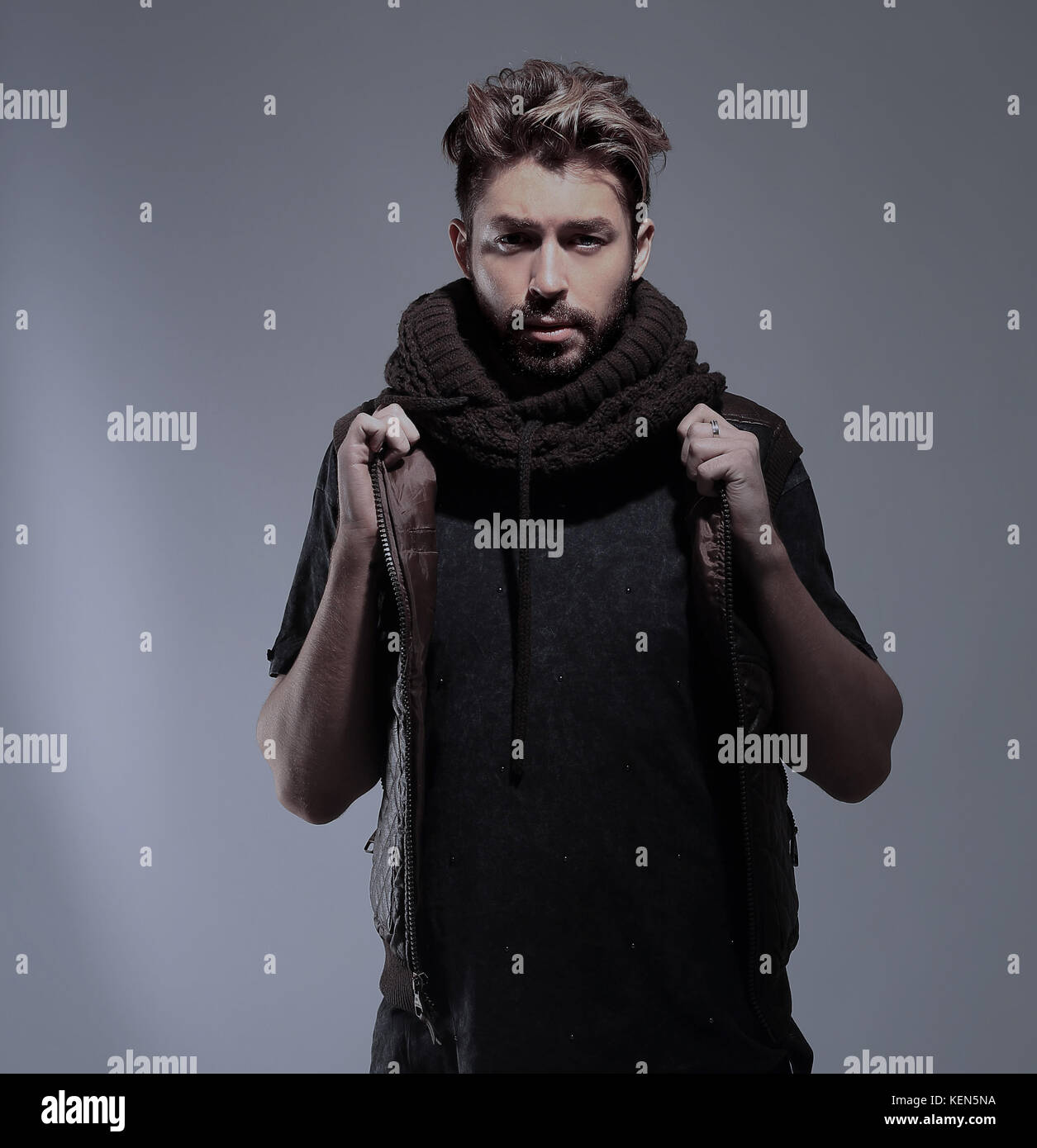 portrait of a stylish young man standing posing Stock Photo - Alamy