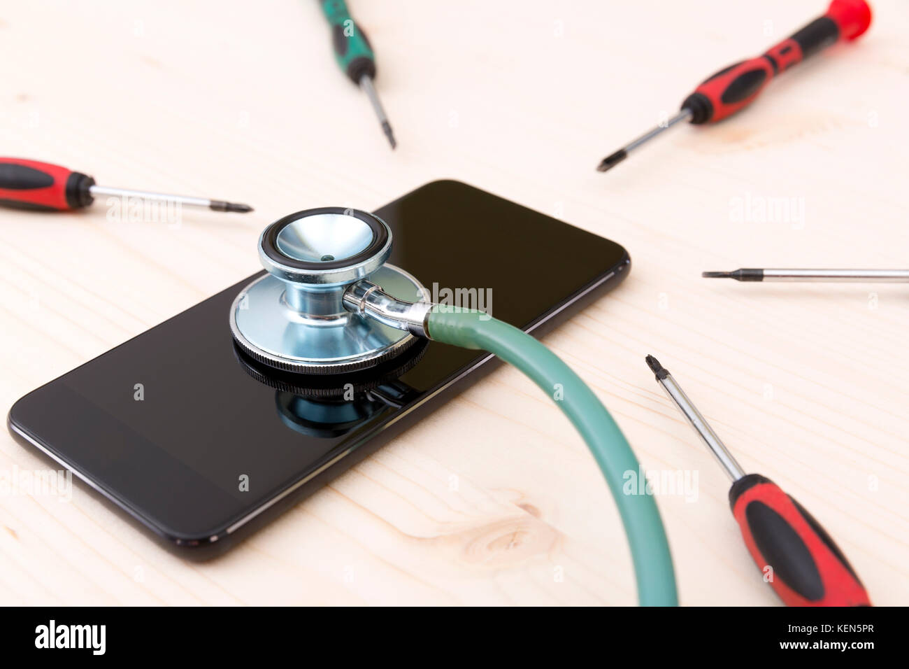 Phone repair and service concept. Smartphone being diagnosed with a ...