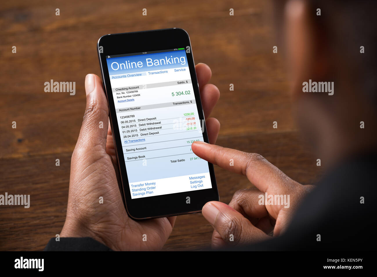 Black man transaction mobile phone hi-res stock photography and images ...