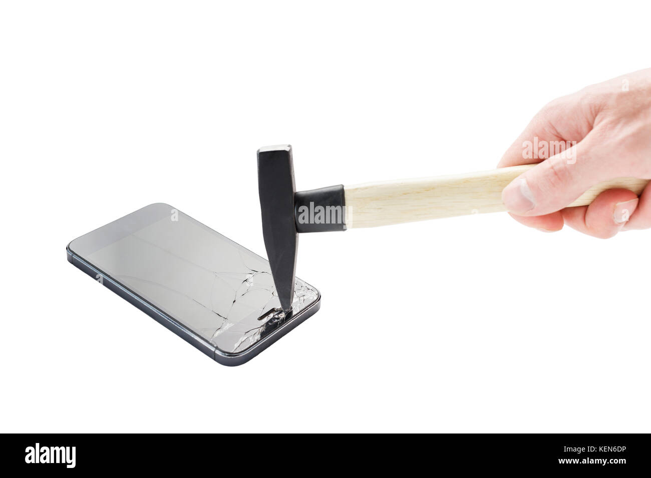 Male hand breaks a smartphone with a hammer against a white background ...