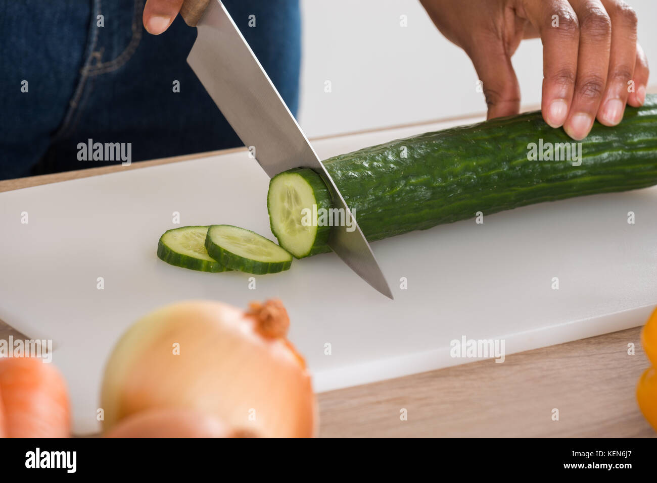 Close-up Of Woman's Hand Chopping Vegetables With Knife In Kitchen ...