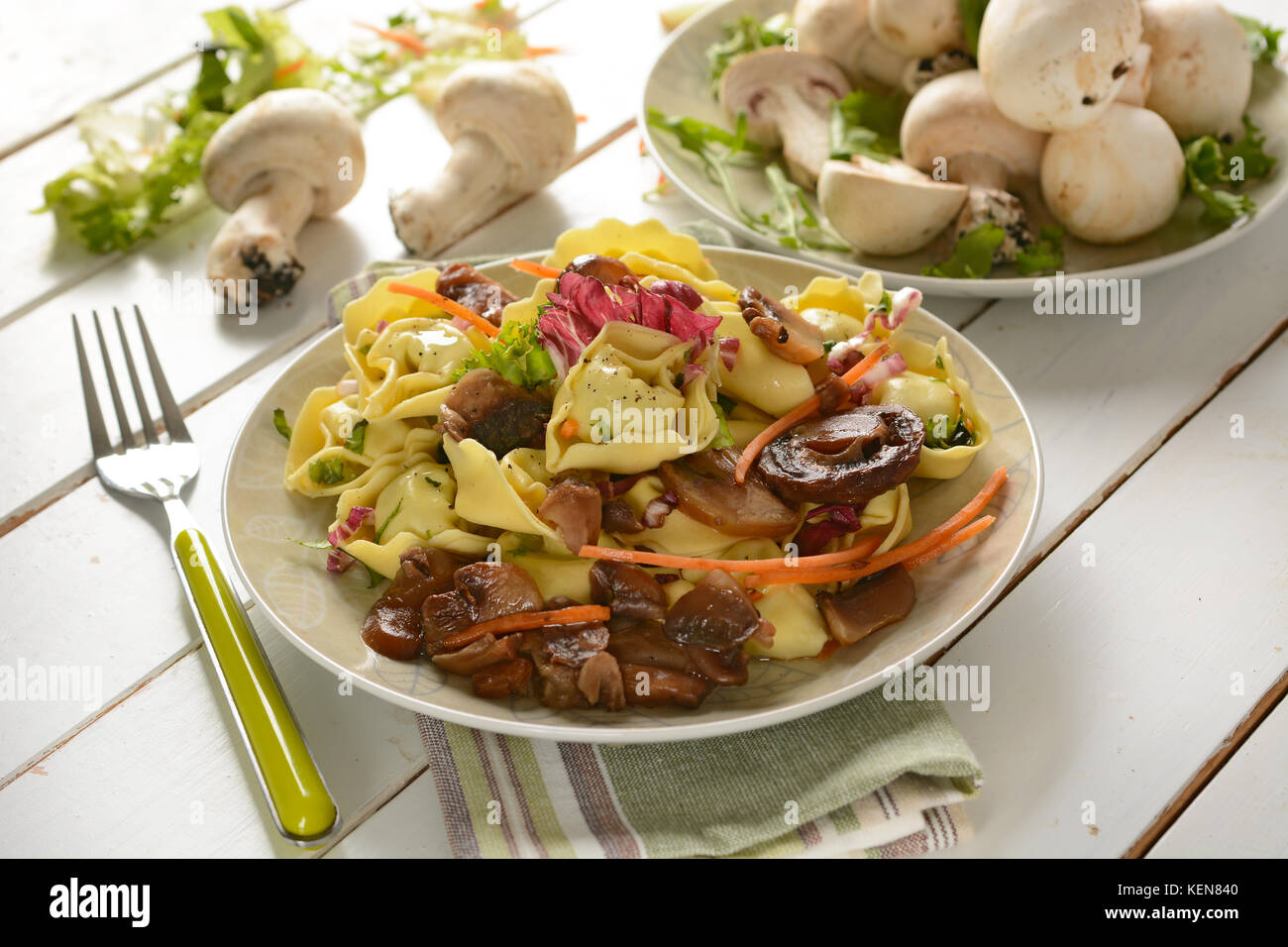 Large tortellini with mushrooms and red chicory - closeup Stock Photo ...